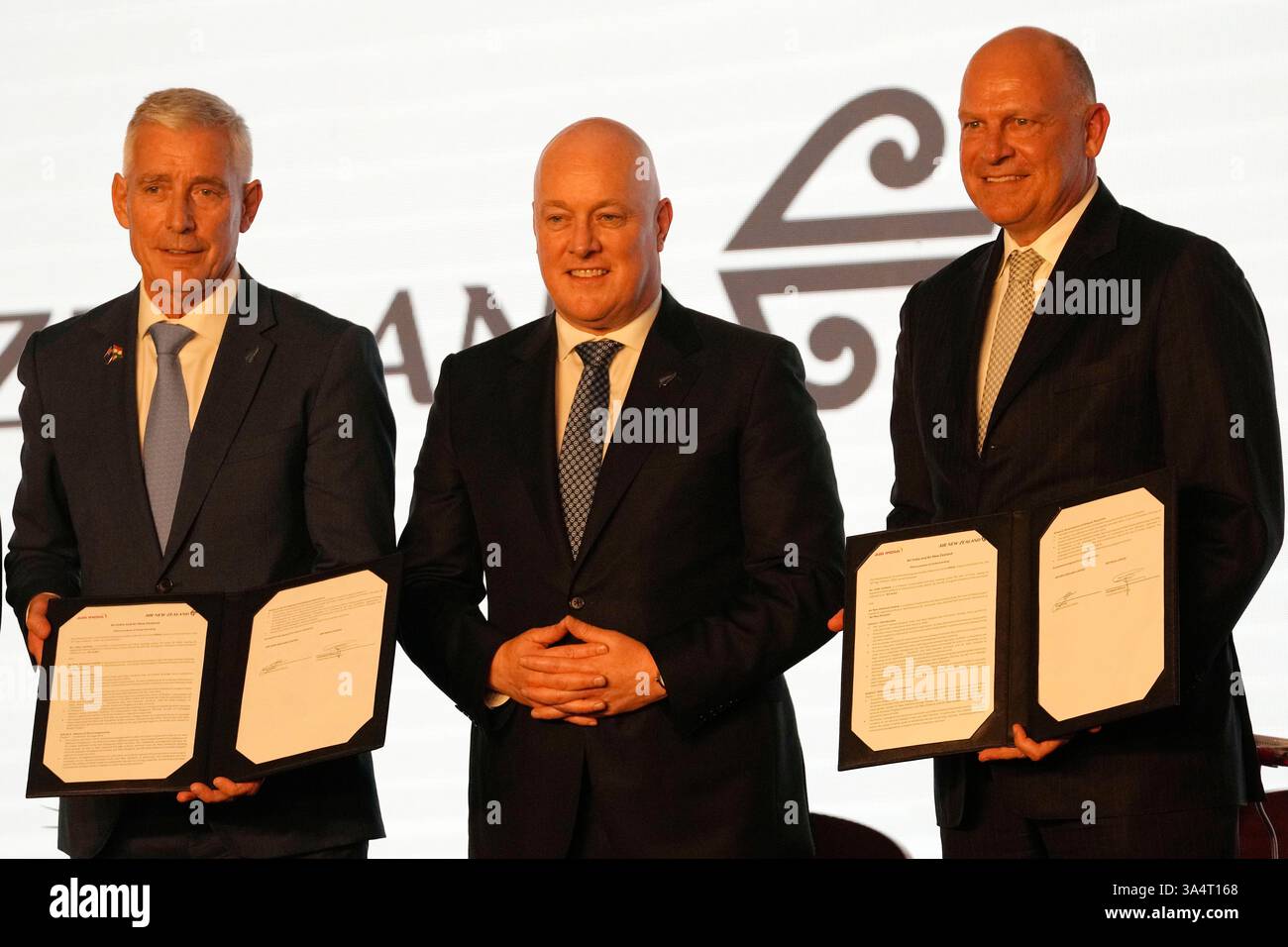 New Zealand Prime minister Christopher Luxon, center along with Air New ...