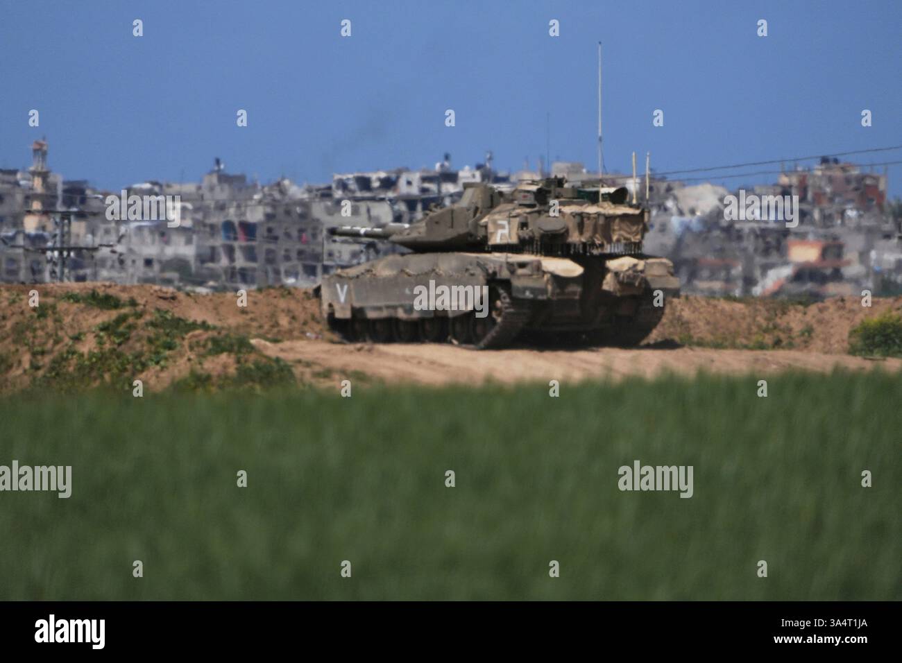 An Israeli tank takes position on the Gaza Strip border in southern Israel, Wednesday, March 19 ...