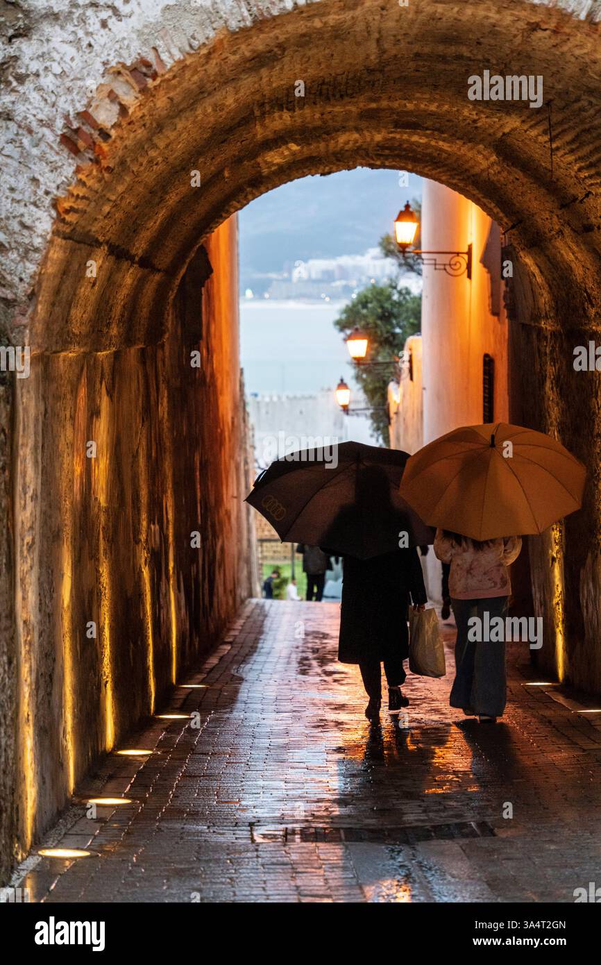illuminated alley next to the city wall, Tangier, Morocco, North Africa ...
