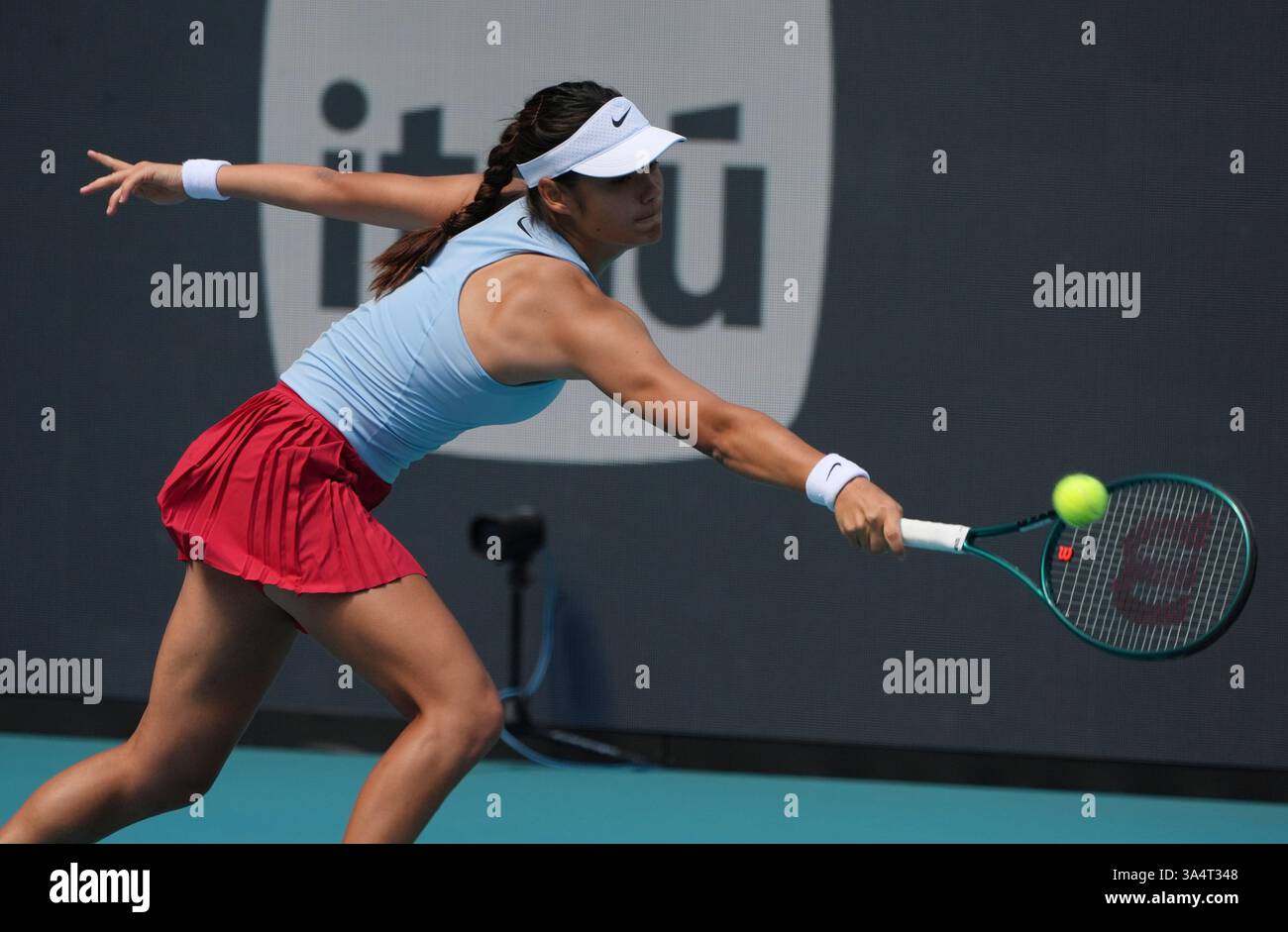 Emma Raducanu, of Great Britain, hits a return to Sayaka Ishii, of Japan, during the Miami Open ...