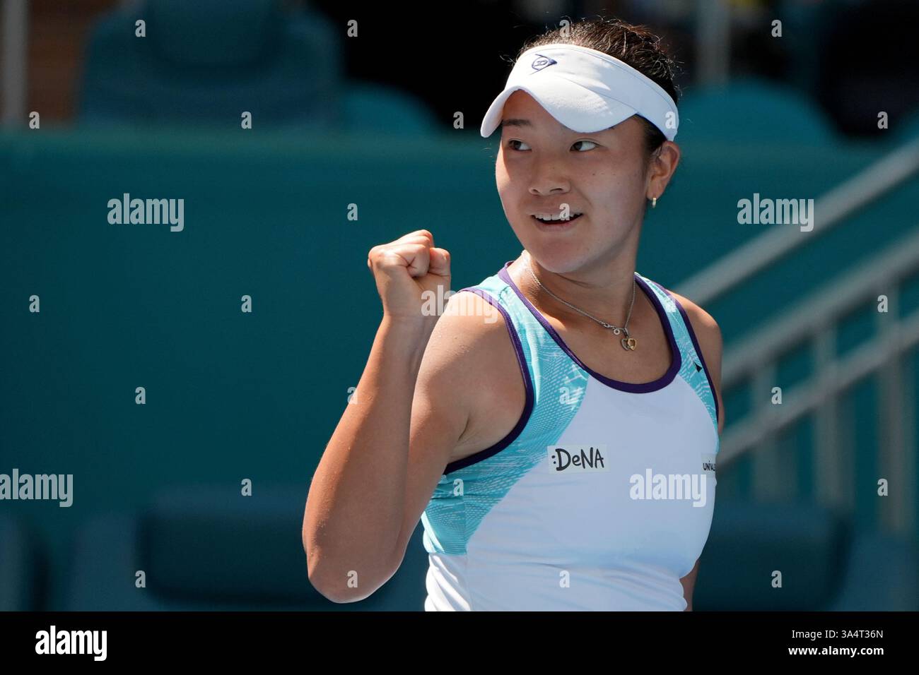 Sayaka Ishii, of Japan, reacts after breaking Emma Raducanu, of Great Britain, during the Miami ...