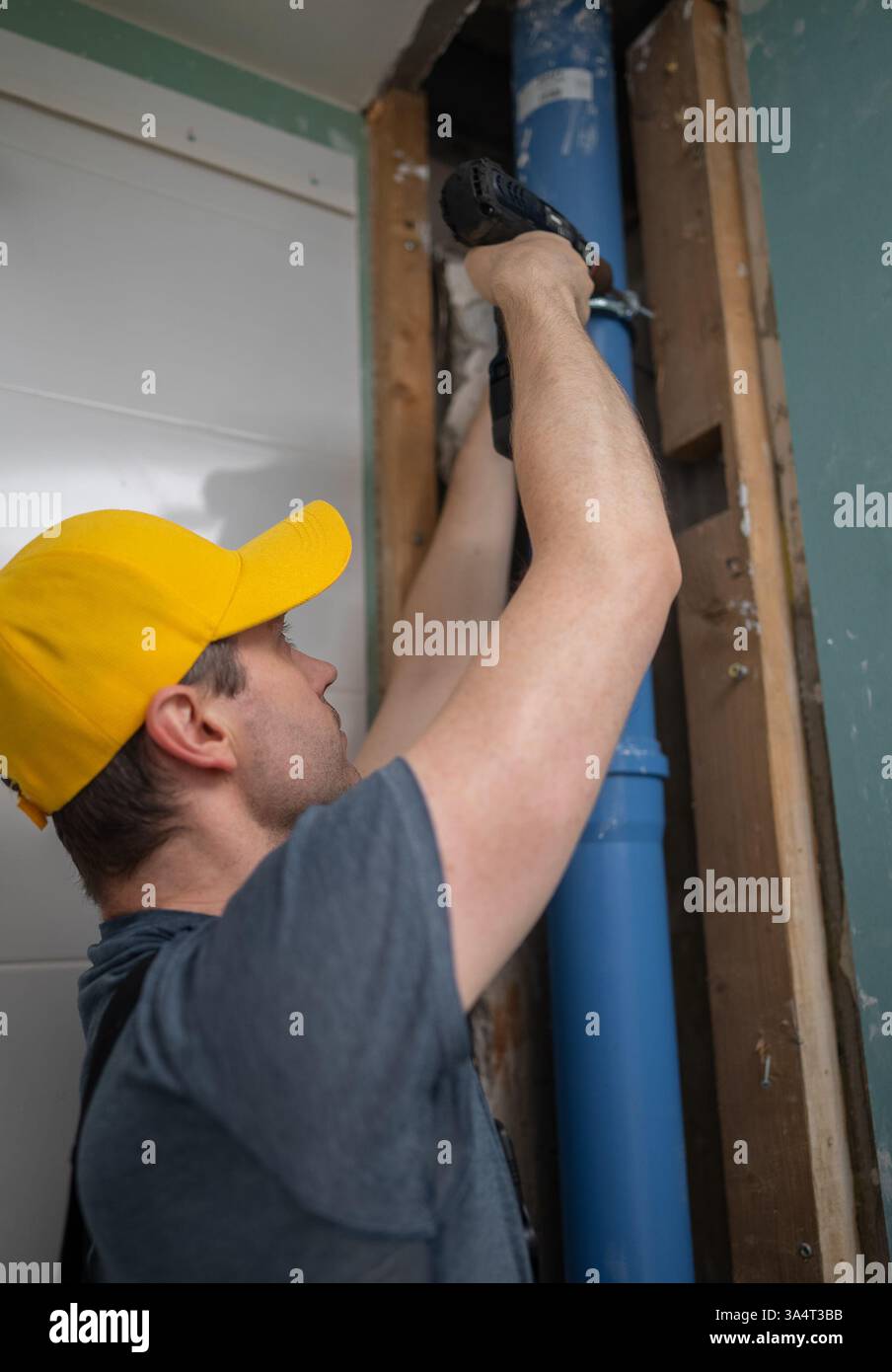 Construction worker installing drain hi-res stock photography and ...