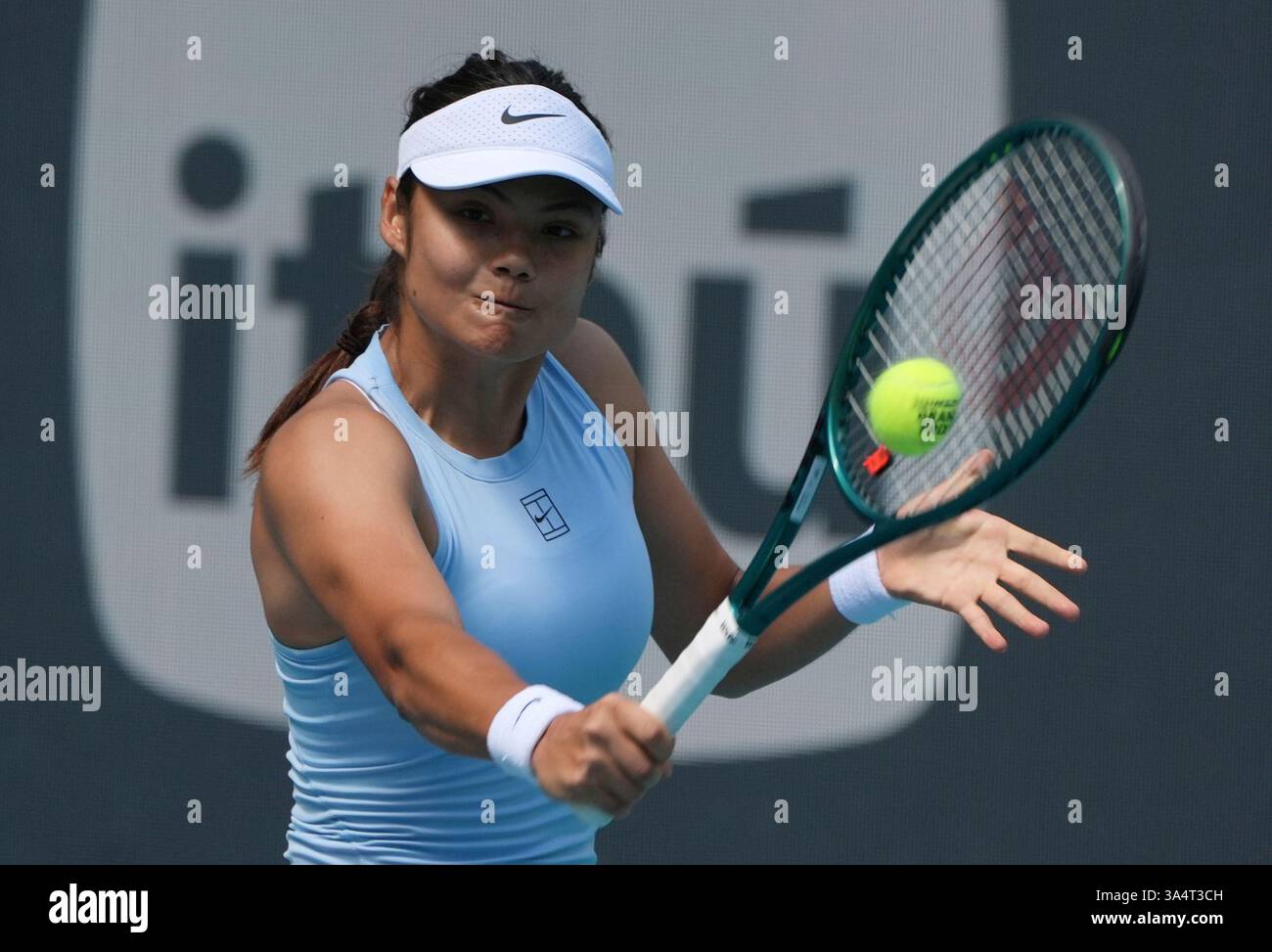 Emma Raducanu, of Great Britain, hits a return to Sayaka Ishii, of Japan, during the Miami Open ...