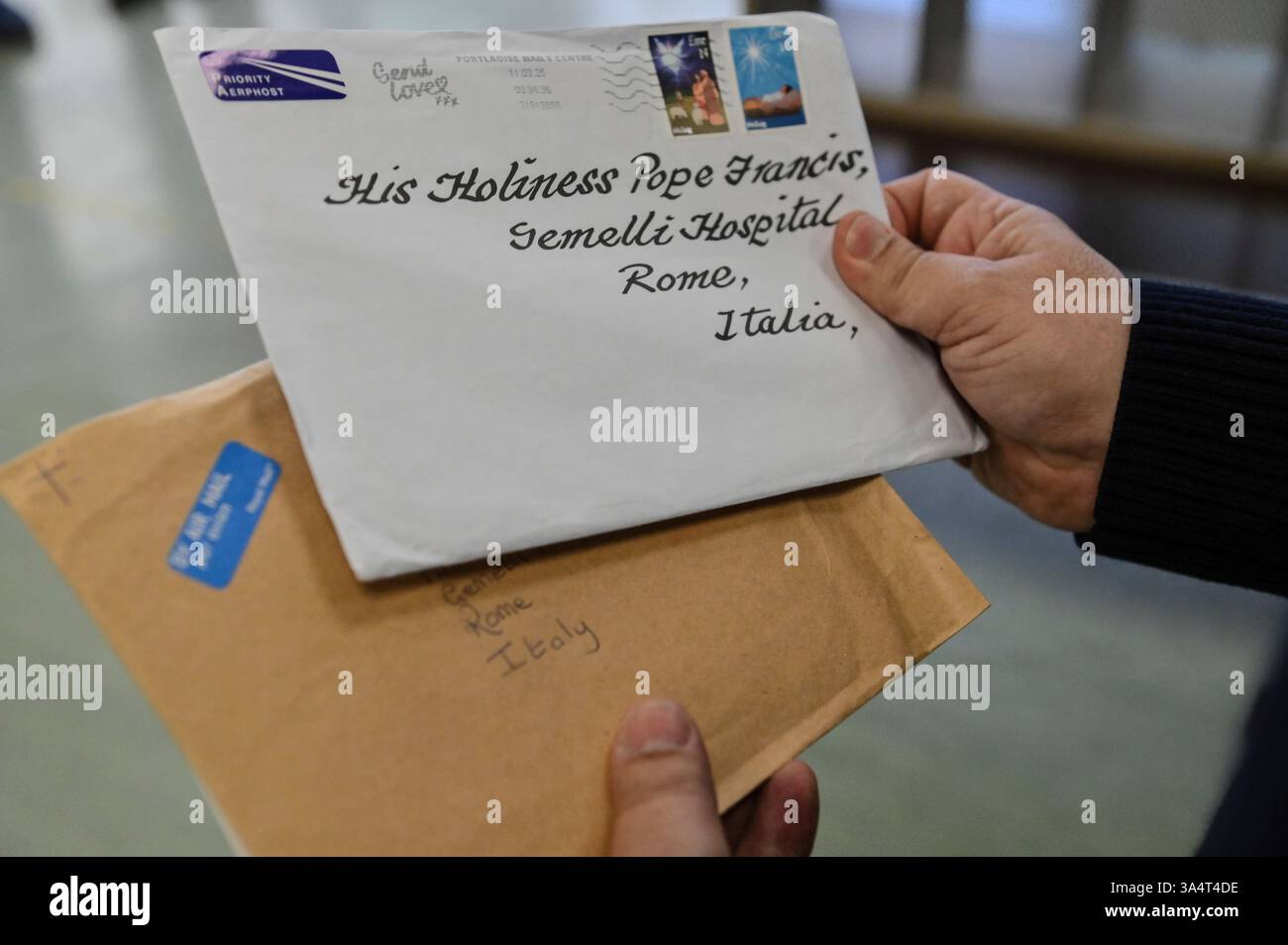 An employee of the Belsito postal distribution center in Rome sorts ...