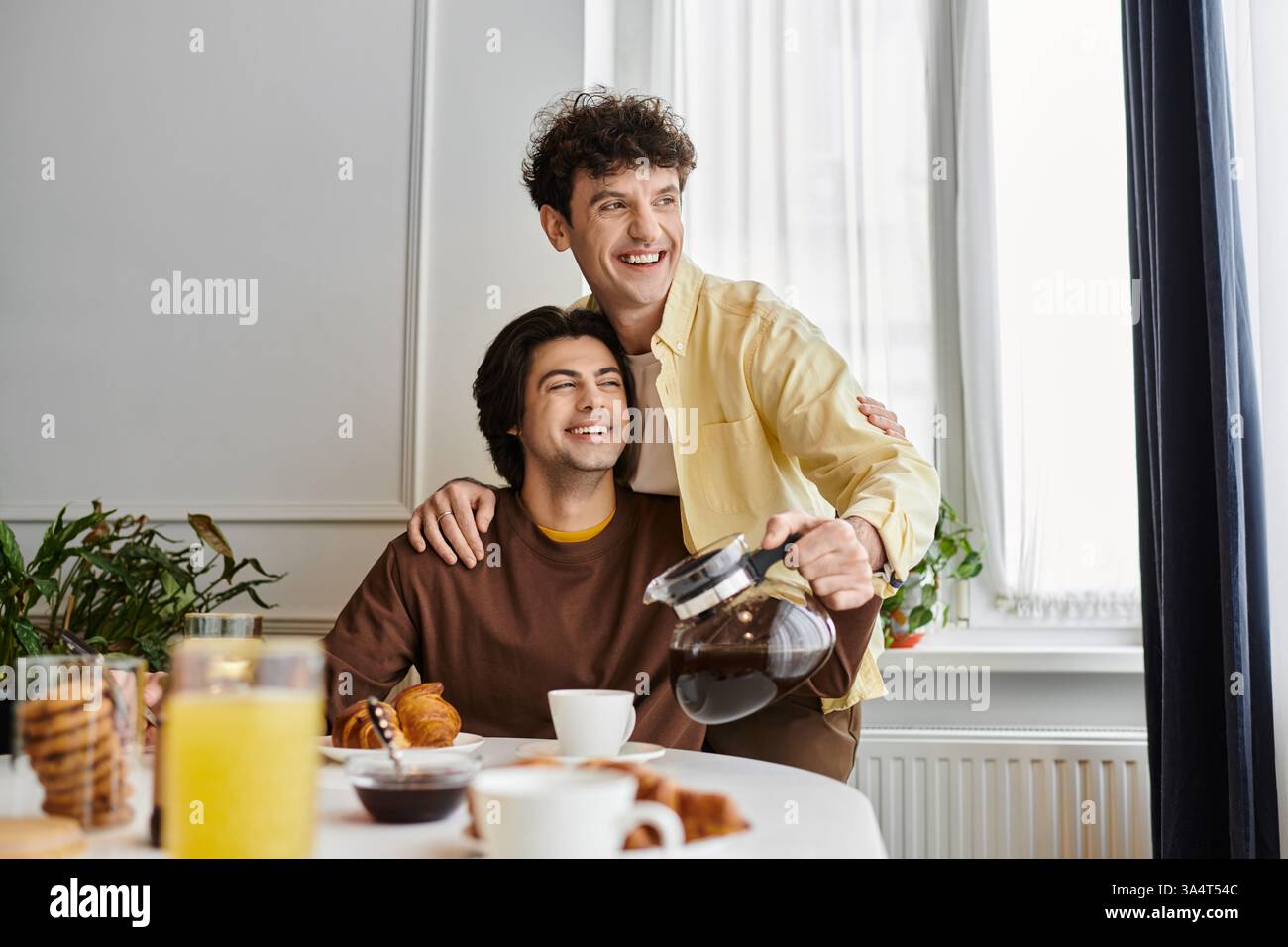 Gay couple share breakfast hi-res stock photography and images - Alamy