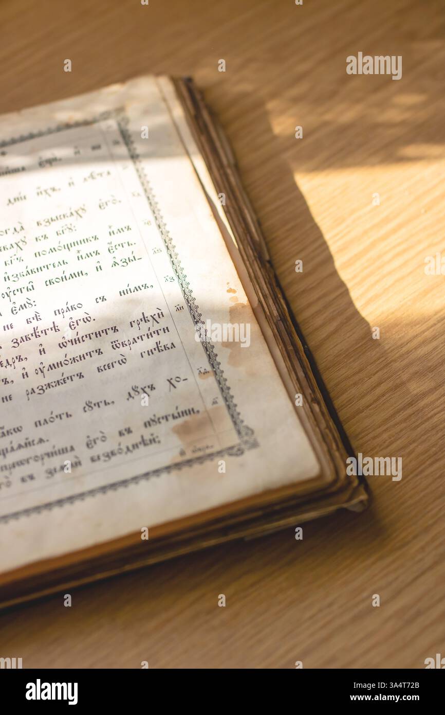 A book is currently open, displaying a page that features the letter a ...