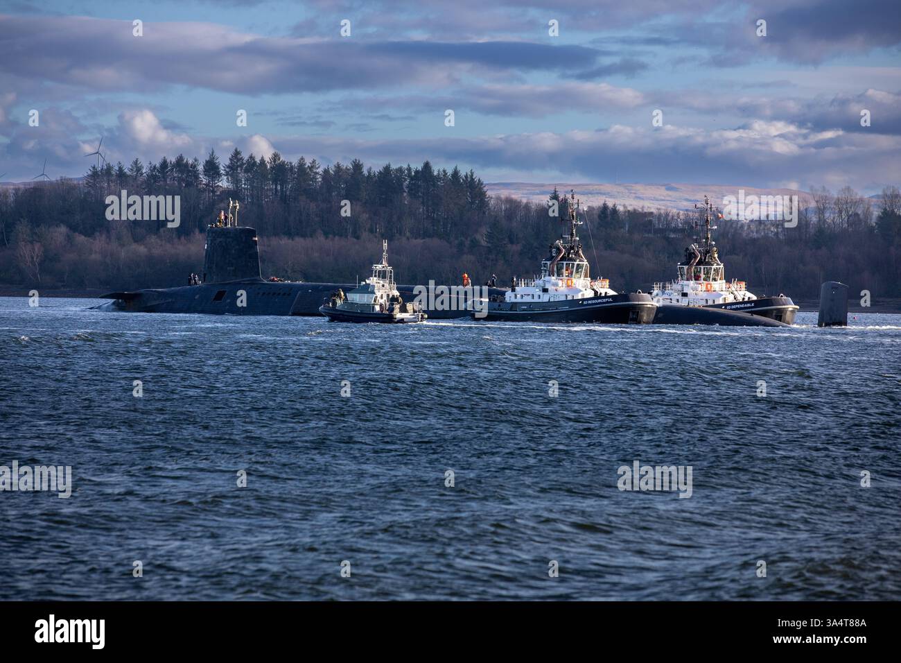 A Vanguard class nuclear submarine leaving Faslane through the Rhu ...