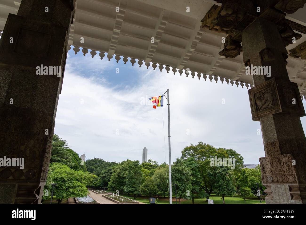 Buddhist Flag framed by silhouette of Independence Memorial Museum ...