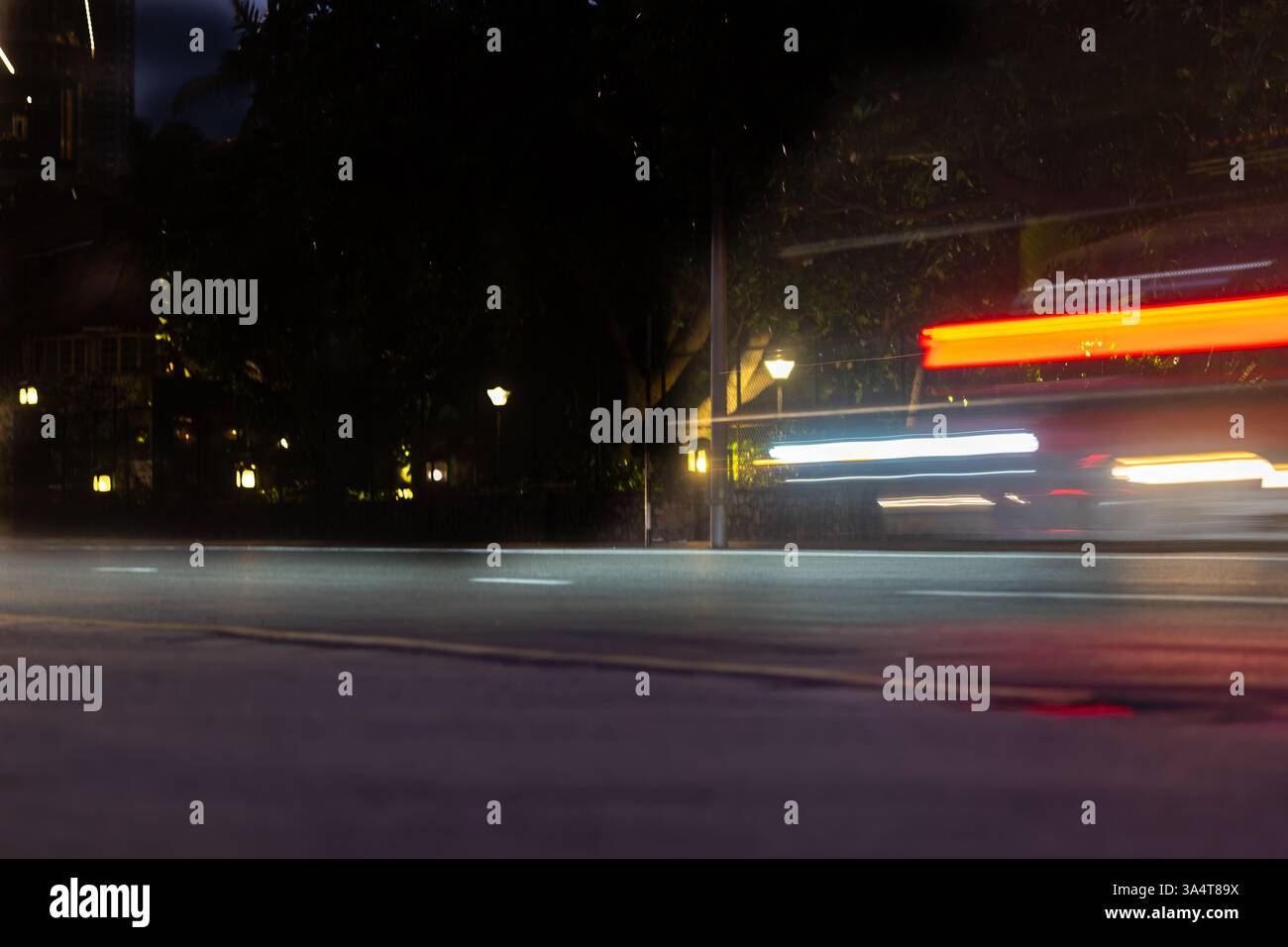 Urban abstract coloured light streams from passing vehicles against ...