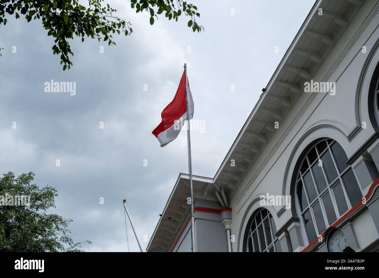 Indonesian flag waving proudly on a building in yogyakarta, indonesia ...