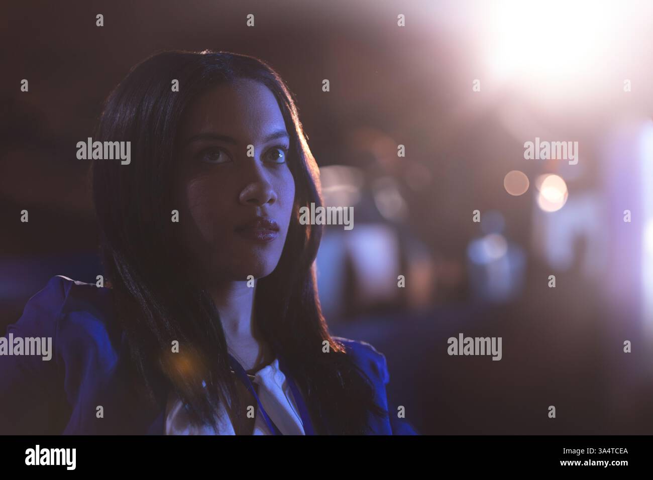 Woman in theater watching movie, focused and captivated by screen Stock ...