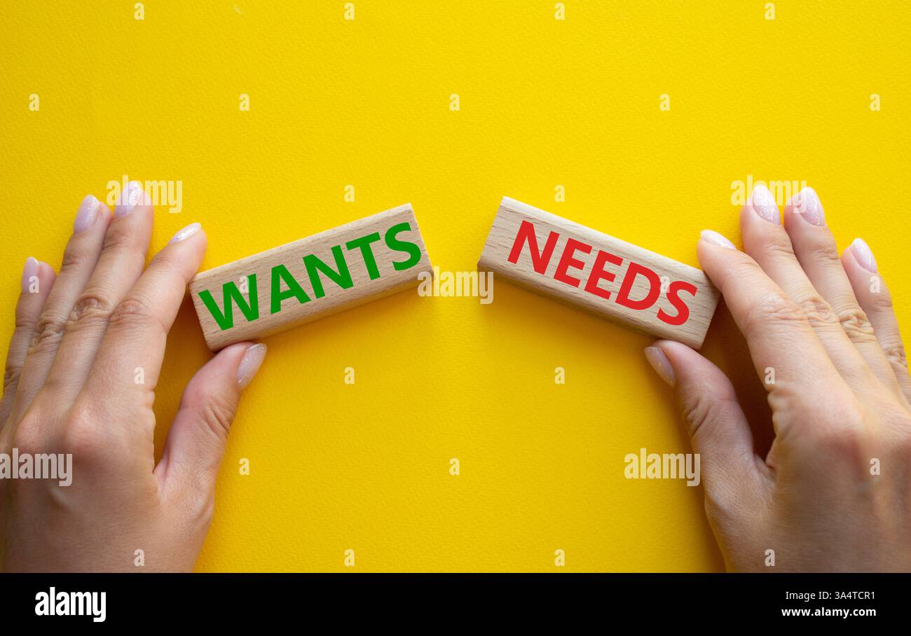 Wants and Needs symbol. Concept word Wants and Needs on wooden blocks ...