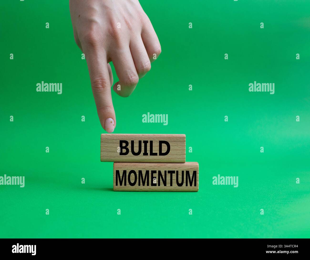 Build momentum symbol. Wooden blocks with words Build momentum ...