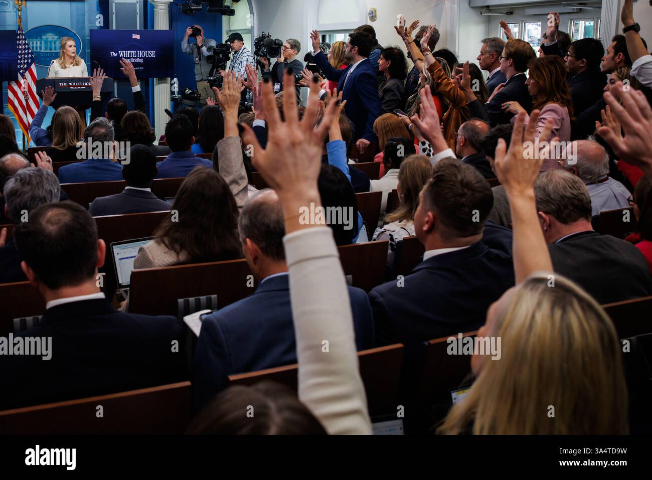 Washington, United States. 19th Mar, 2025. Reporters raise their hands ...