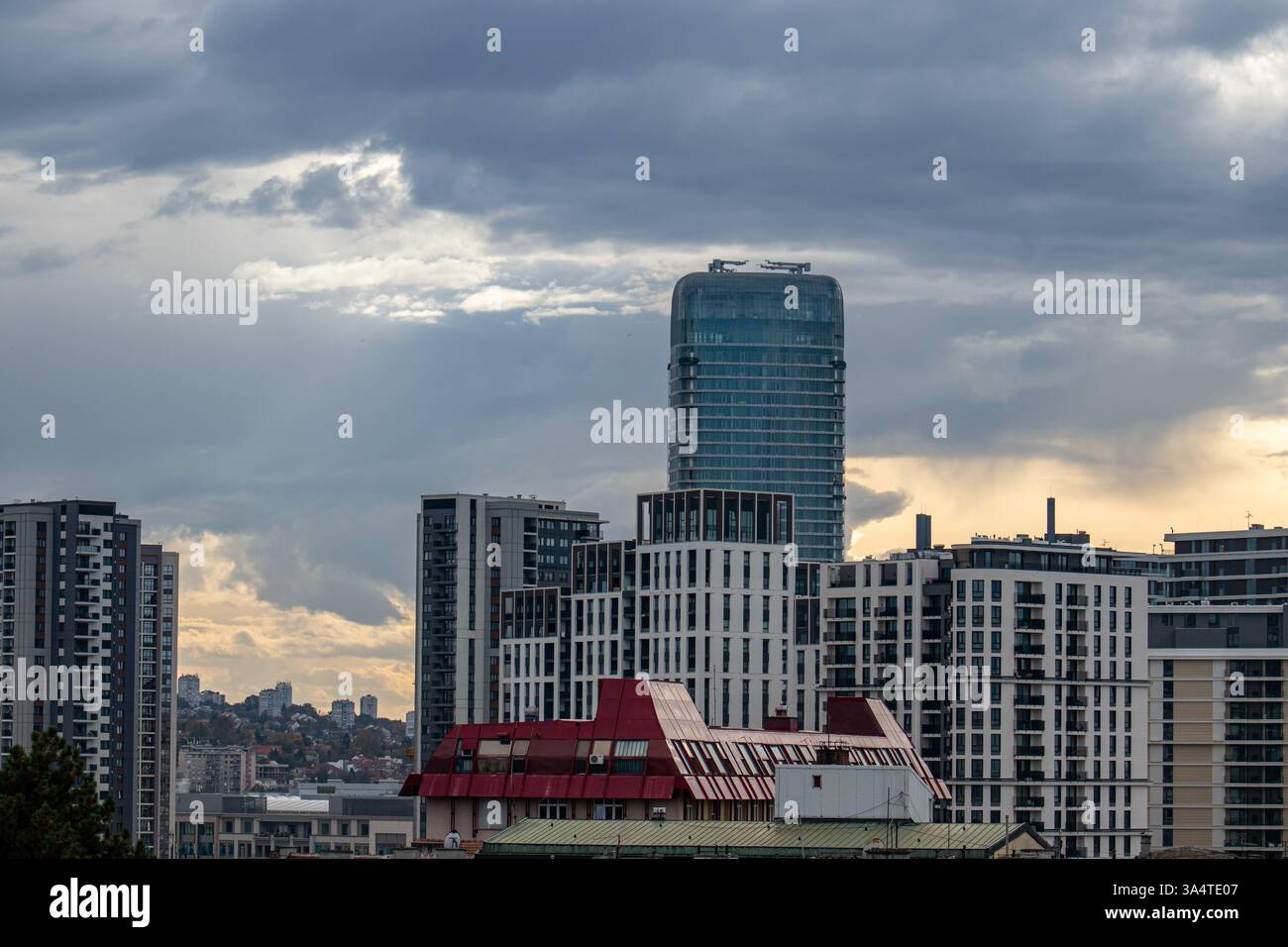 A skyline showcases a variety of modern buildings in a city, with ...