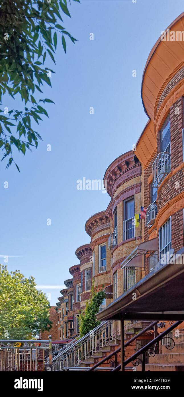 A row of brick-and-terra-cotta two-family homes on 58th Street in ...