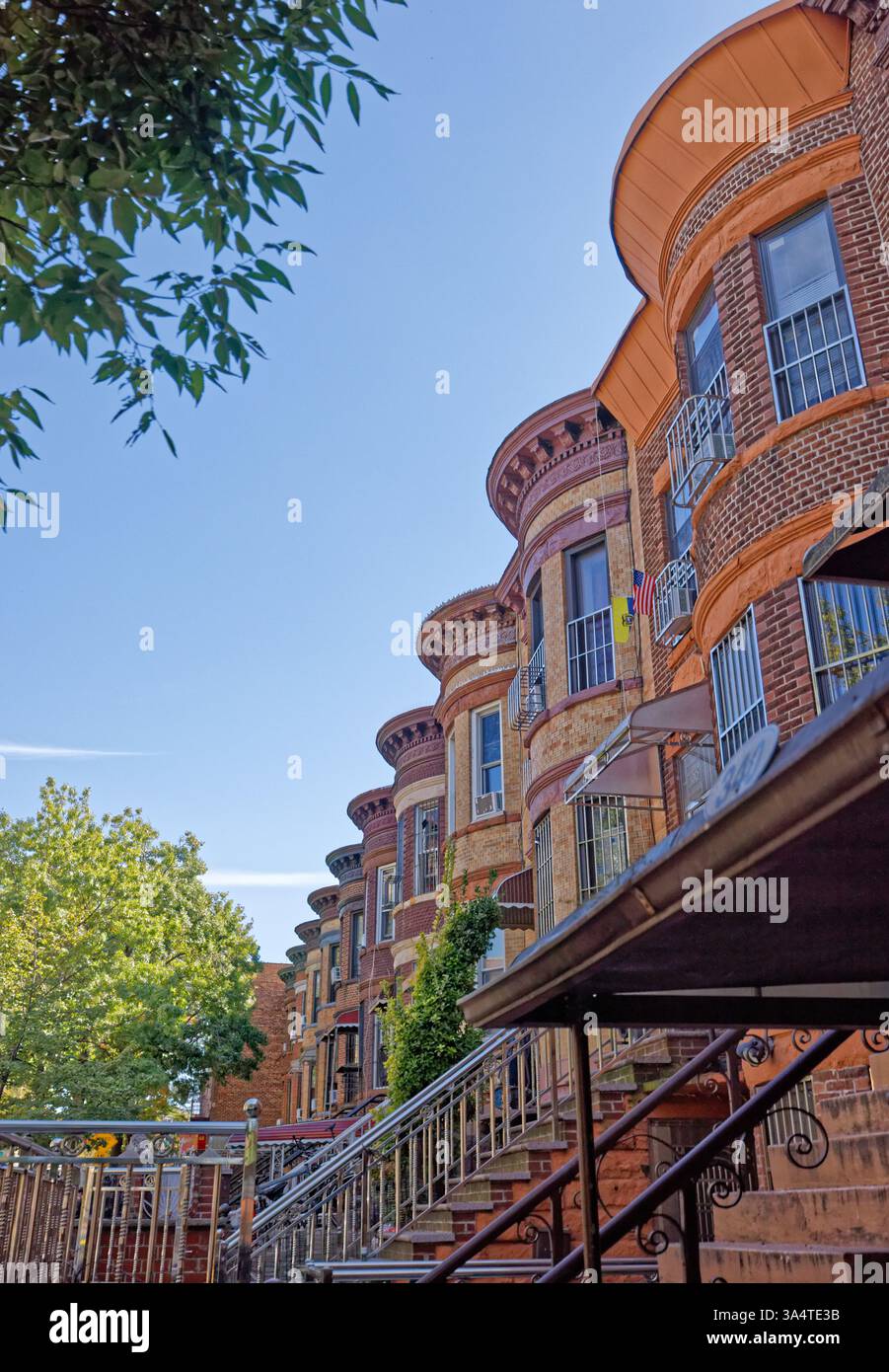 A row of brick-and-terra-cotta two-family homes on 58th Street in ...