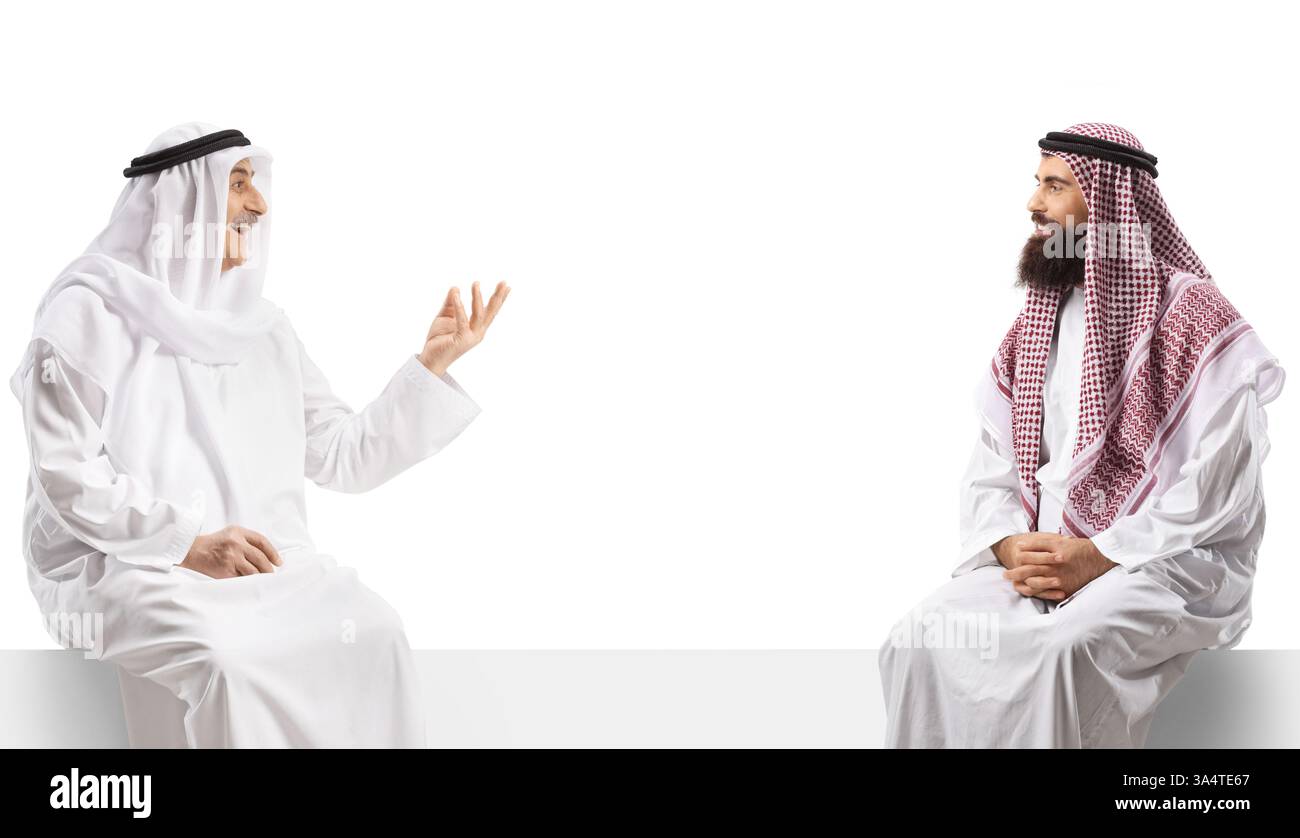 Middle eastern men seated on a white panel having a conversation ...
