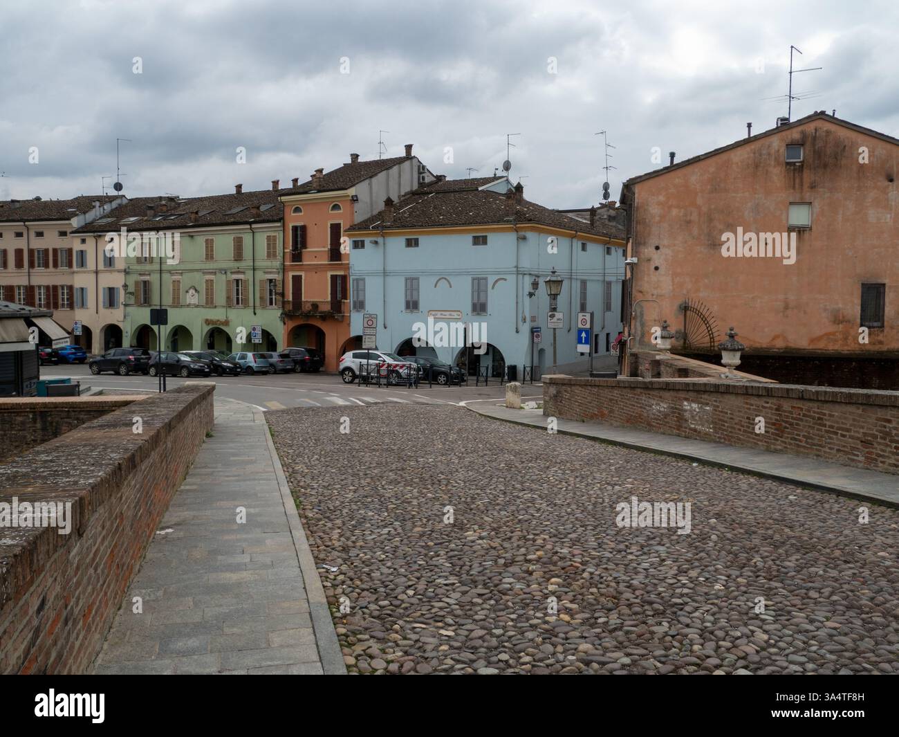 Colorno, Italy March 1st 2025 Cobblestone street leading into the main ...