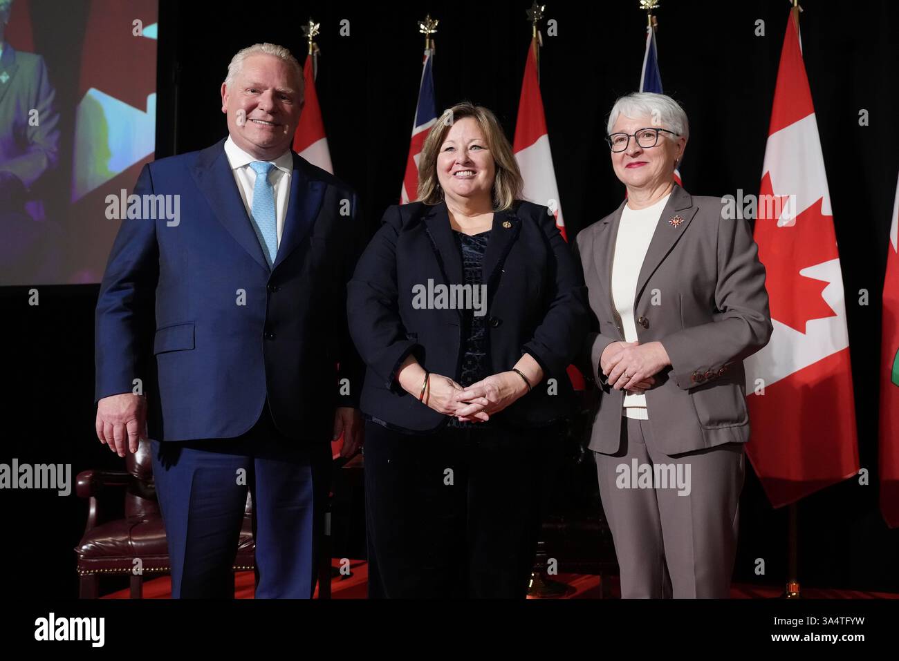 Toronto, Canada. 19th Mar, 2025. Ontario Premier Doug Ford, left to ...