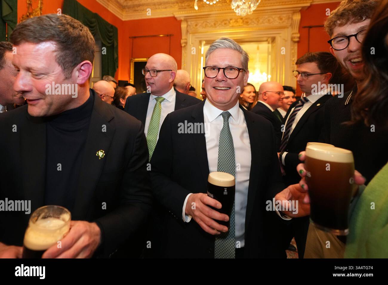 Prime Minister Sir Keir Starmer holds a pint of Guinness during a ...