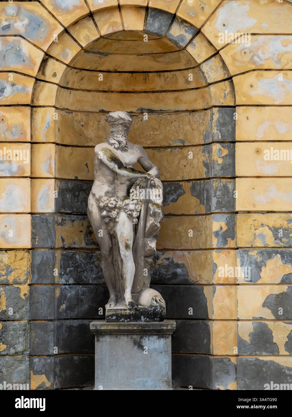 Colorno, Italy March 1st 2025 Weathered statue of the greek god pan ...