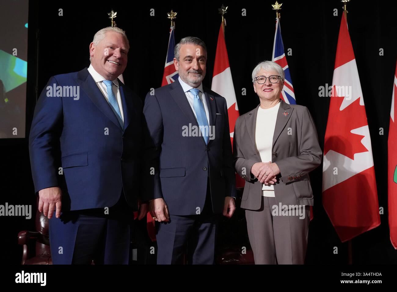 Toronto, Canada. 19th Mar, 2025. Ontario Premier Doug Ford, left to ...