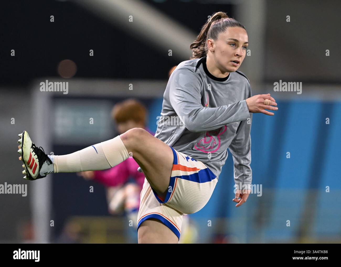 Manchester, UK. 19th Mar, 2025. Niamh Charles of Chelsea warms up ahead ...