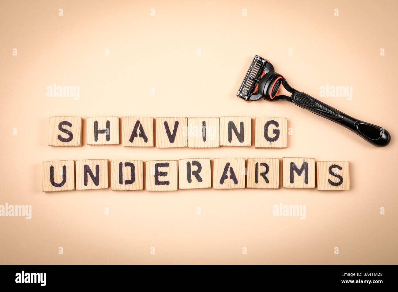 Shaving Underarms. Text made from wooden alphabet letters on a light ...