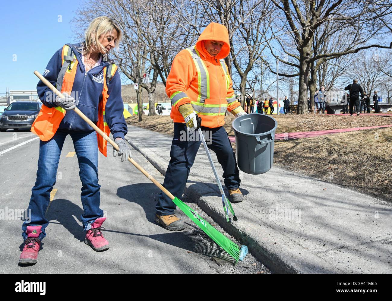 City workers pick up trash prior to a news conference by Montreal Mayor ...