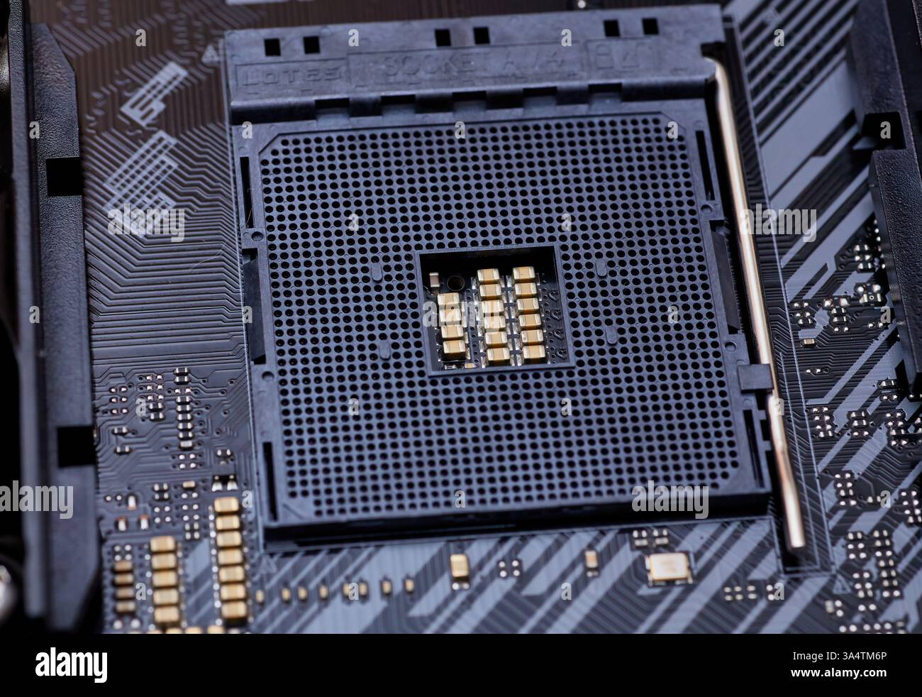 A close-up view of an AM4 CPU socket on a motherboard. This detailed image shows the precision ...