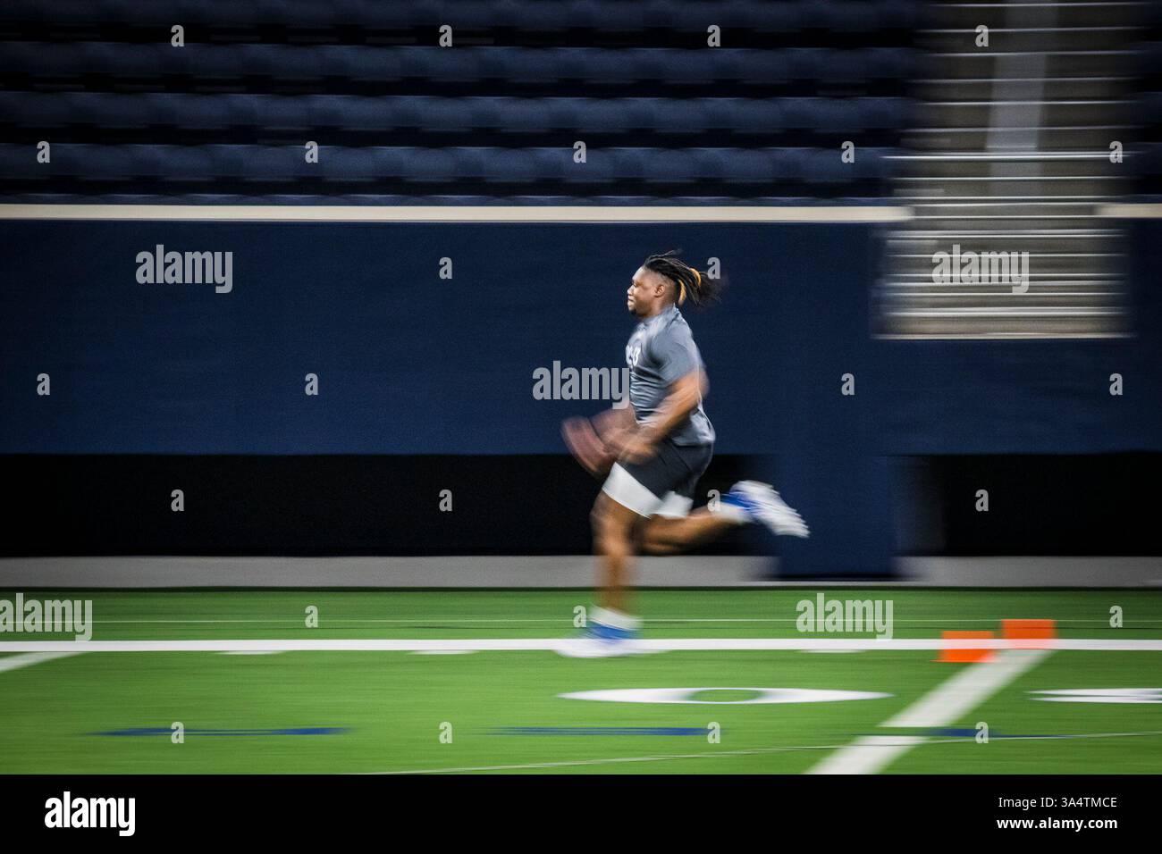 In this image taken with a slow shutter speed, Kansas' Jereme Robinson ...