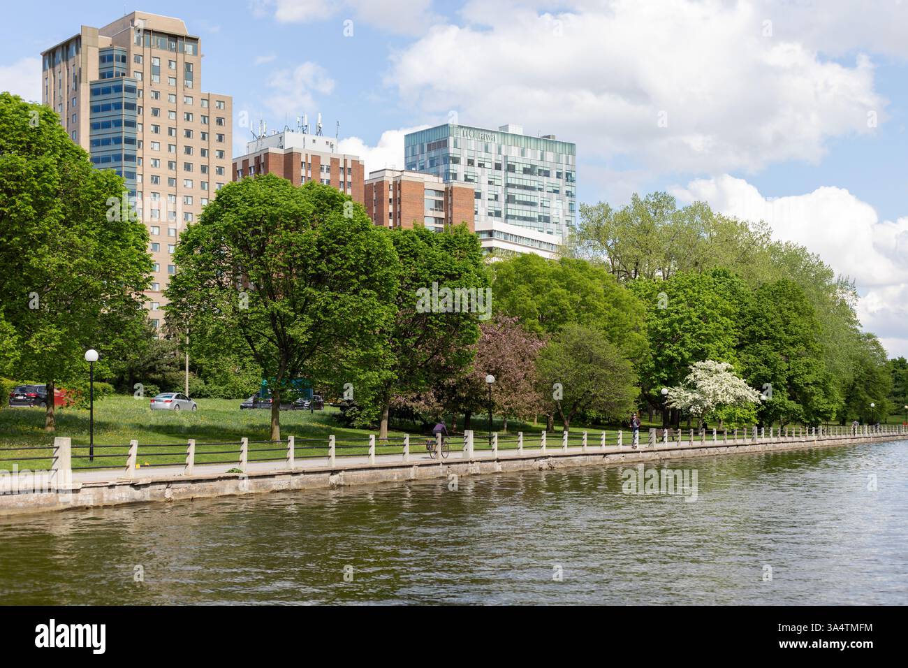 Ottawa, Canada - May 16, 2024: Rideau Canal in spring. Cityscape along ...