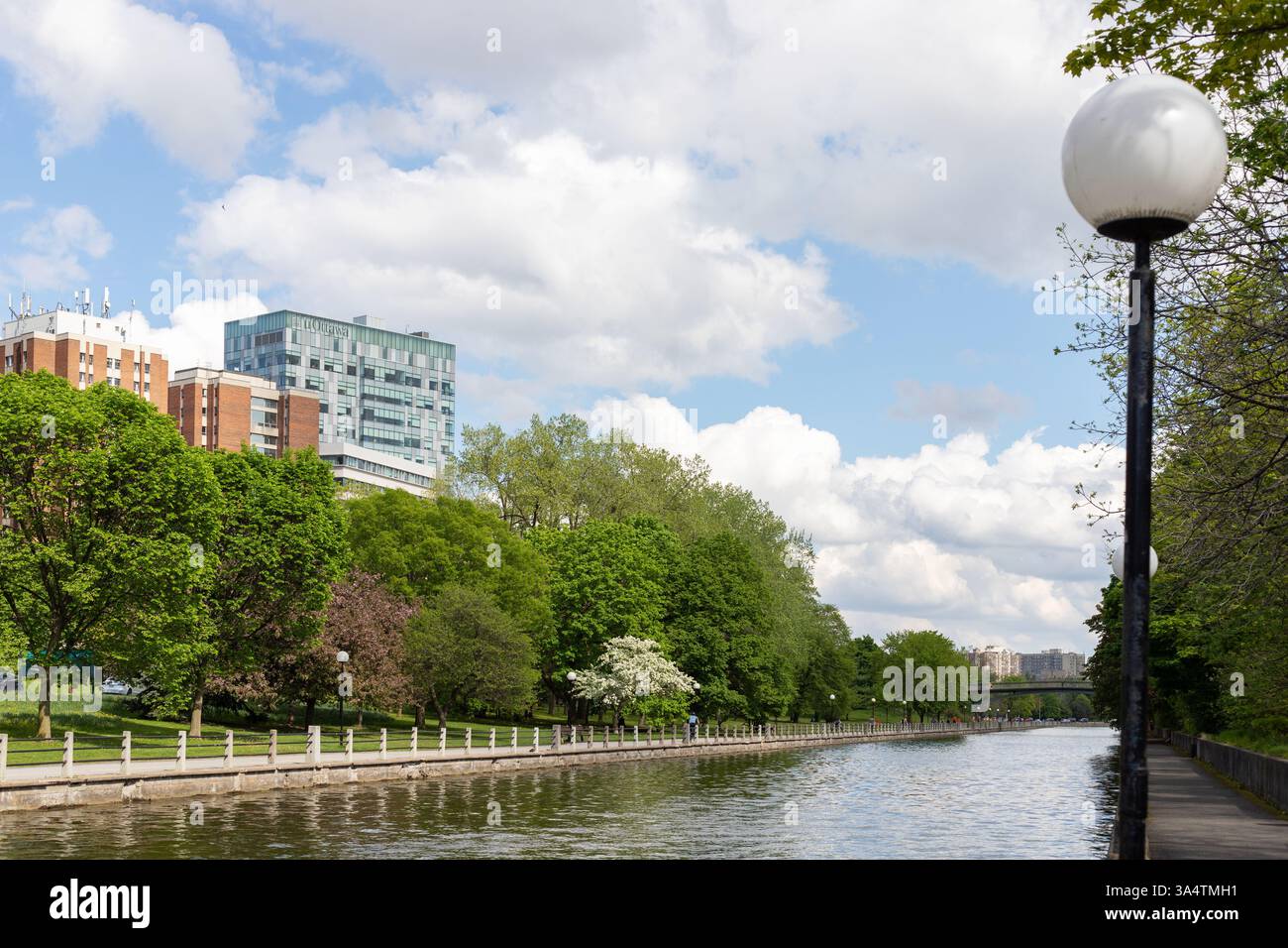 Ottawa, Canada - May 16, 2024: Rideau Canal in spring. Cityscape along ...