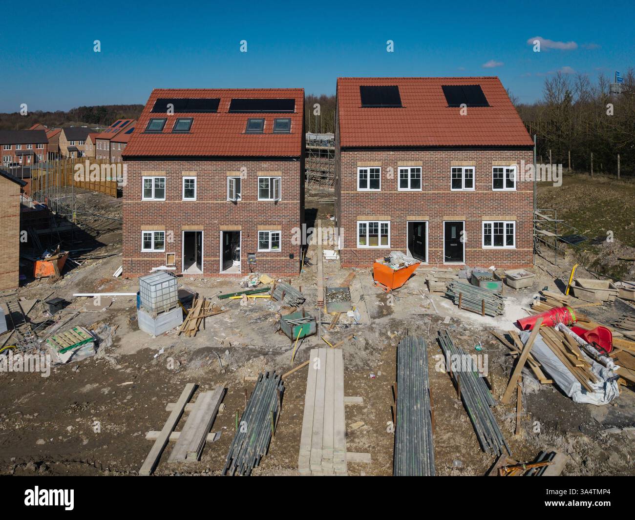 A row of characterless new build houses on a construction site with in ...