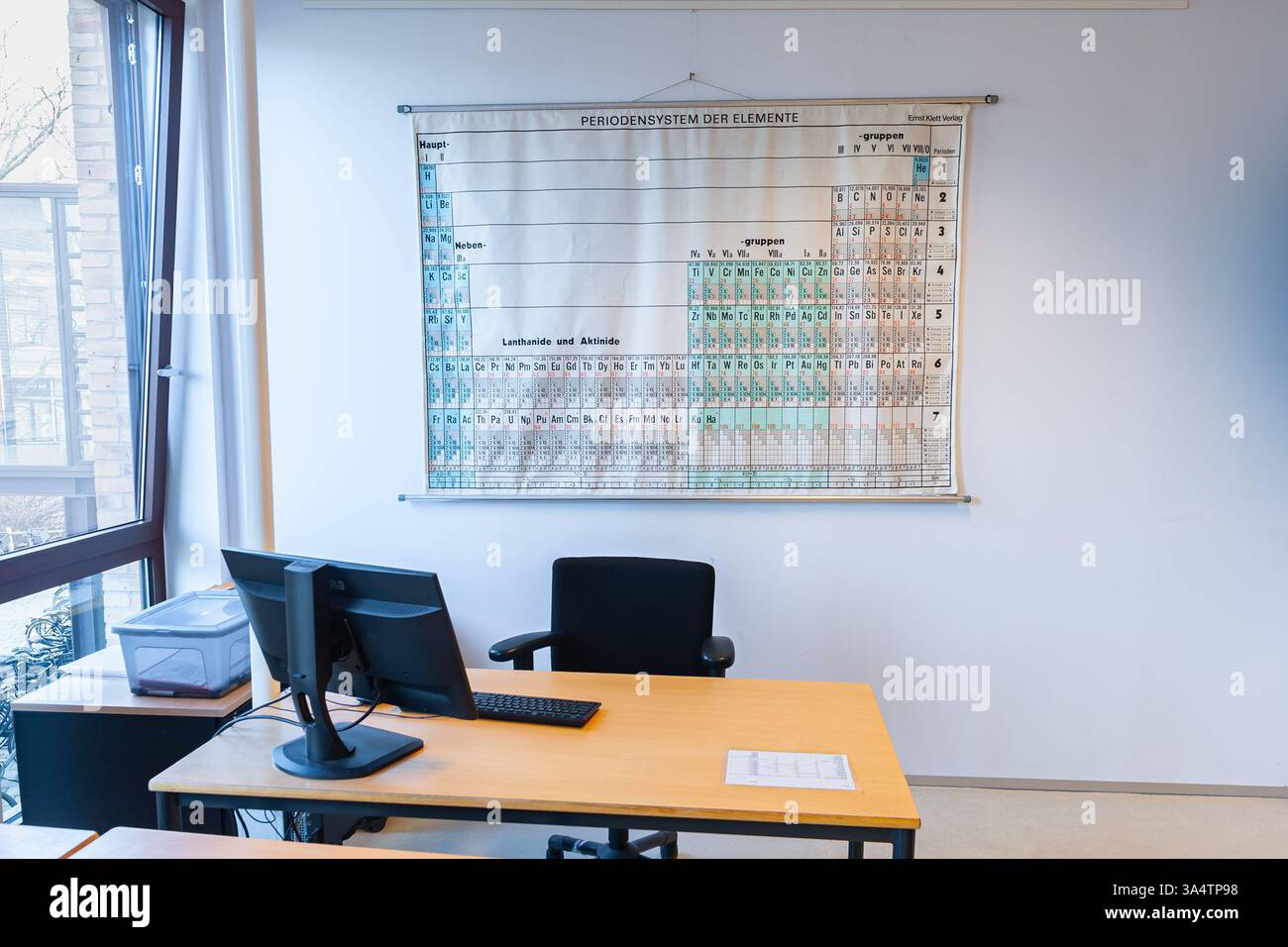 Map showing the chemistry system of elements above a desk in a high ...