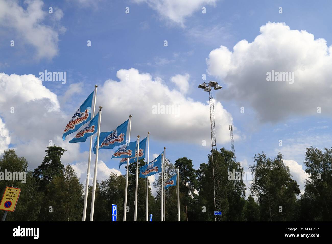 Several flags in the sky at Skara Sommarland. Cloudy day during the ...