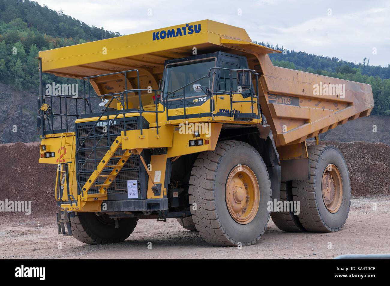 Raon-l'Étape, France - View on a yellow rigid dump truck Komatsu HD785 ...
