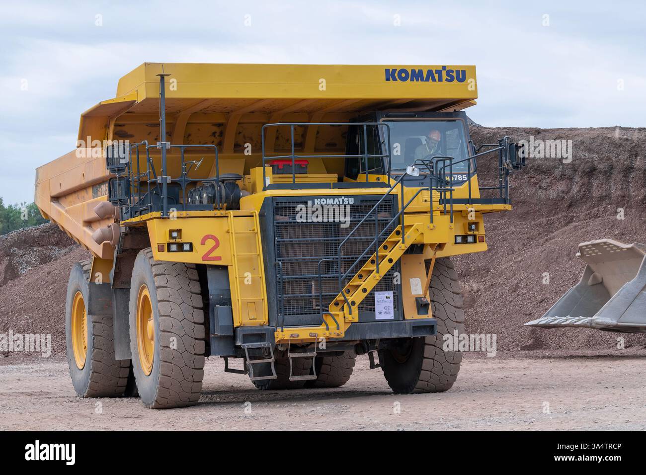 Raon-l'Étape, France - View on a yellow rigid dump truck Komatsu HD785 ...