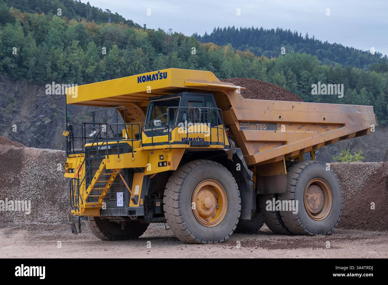 Raon-l'Étape, France - View on a yellow rigid dump truck Komatsu HD785 ...