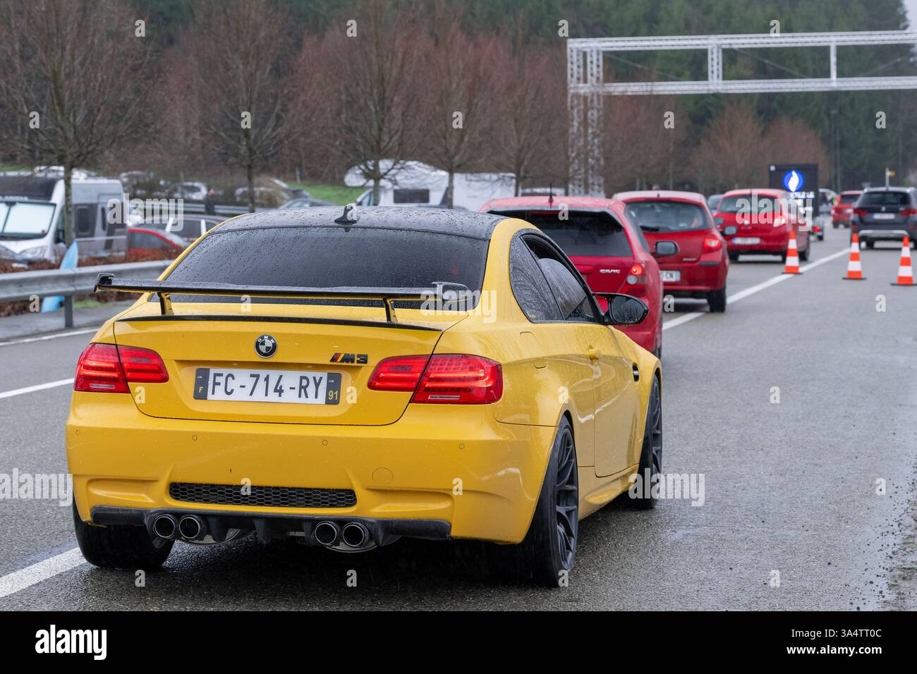 Spa-Francorchamps, Belgium - View on a yellow BMW M3 E92 driving on a ...