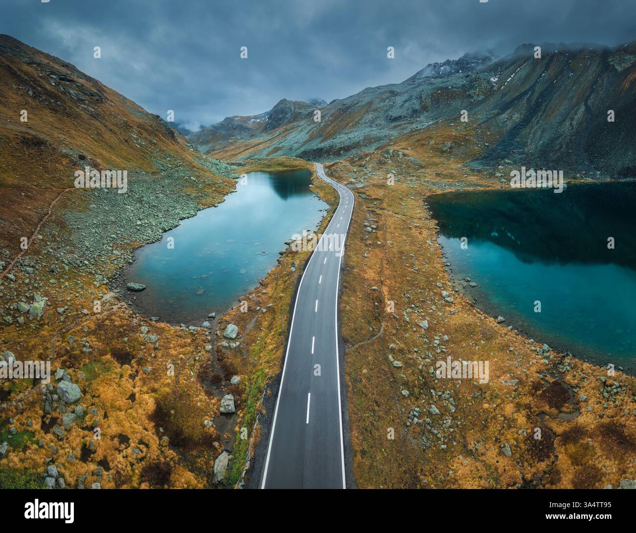 Aerial view of mountain road between two lakes in alpine valley Stock ...