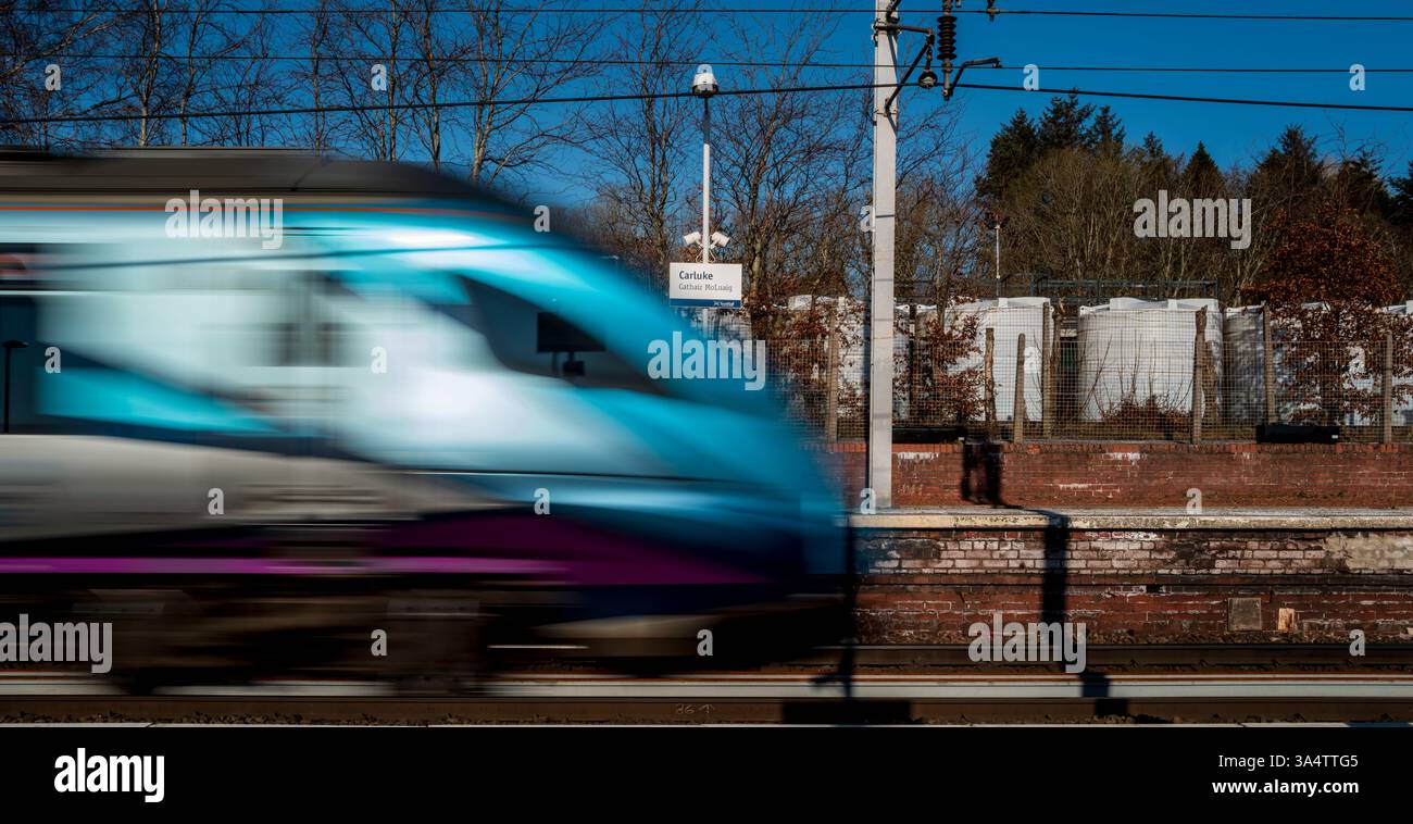Express train passing through Carluke station at speed - South ...