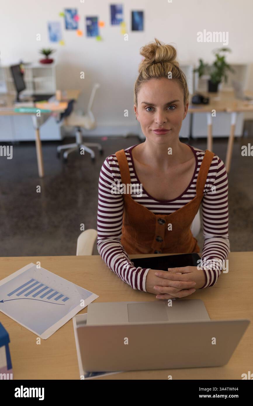 Smiling confidently businesswoman in office hi-res stock photography ...