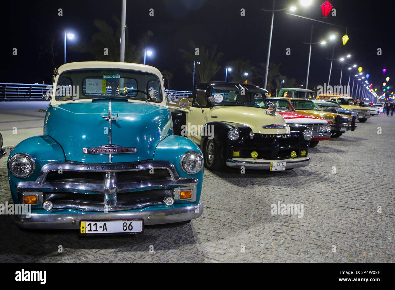 Classic cars are on display on the banks of the Shatt al-Arab waterway ...