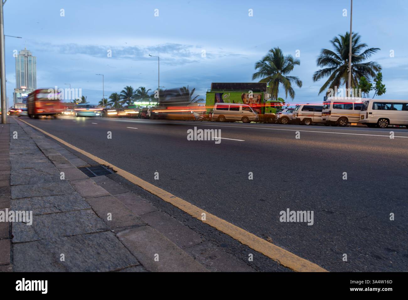 Vehicle light trails along Colombo Main Road at dusk in Sri Lanka Stock ...