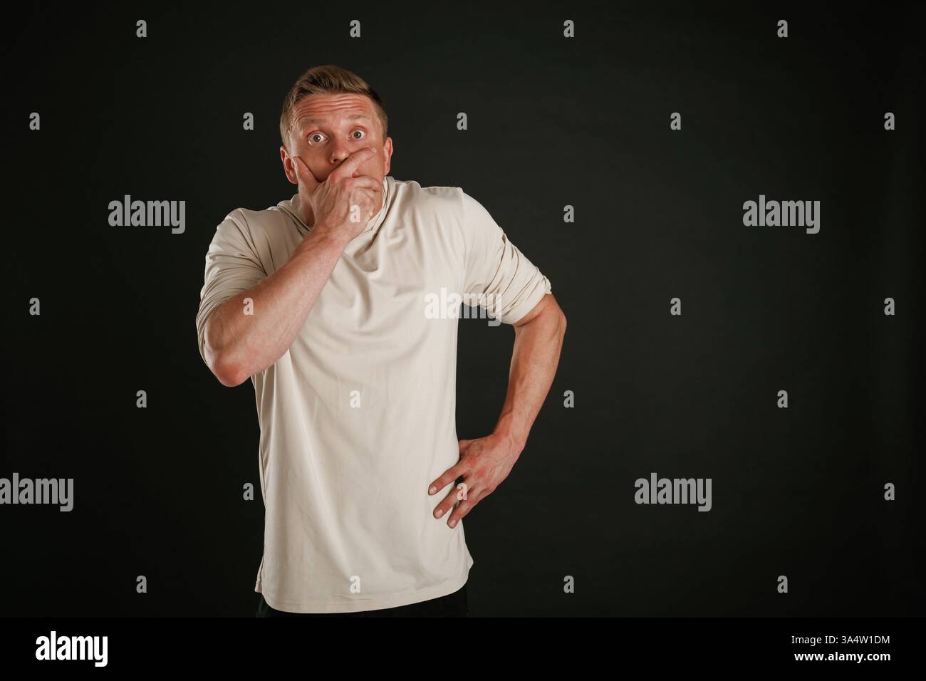 Afraid, scared guy. Man is against background in the studio Stock Photo ...