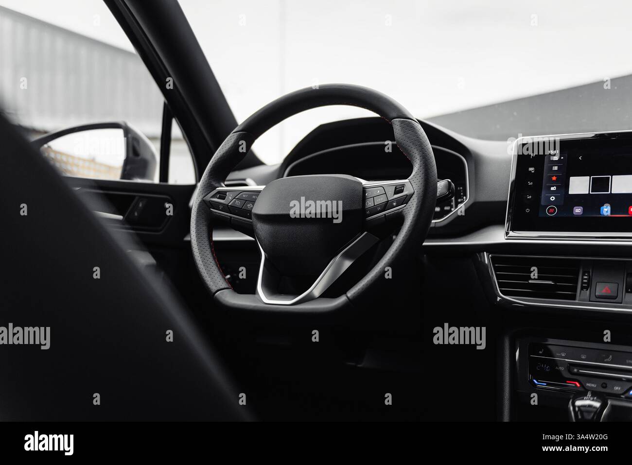 Modern car interior with metal accents. Steering wheel and dashboard of ...