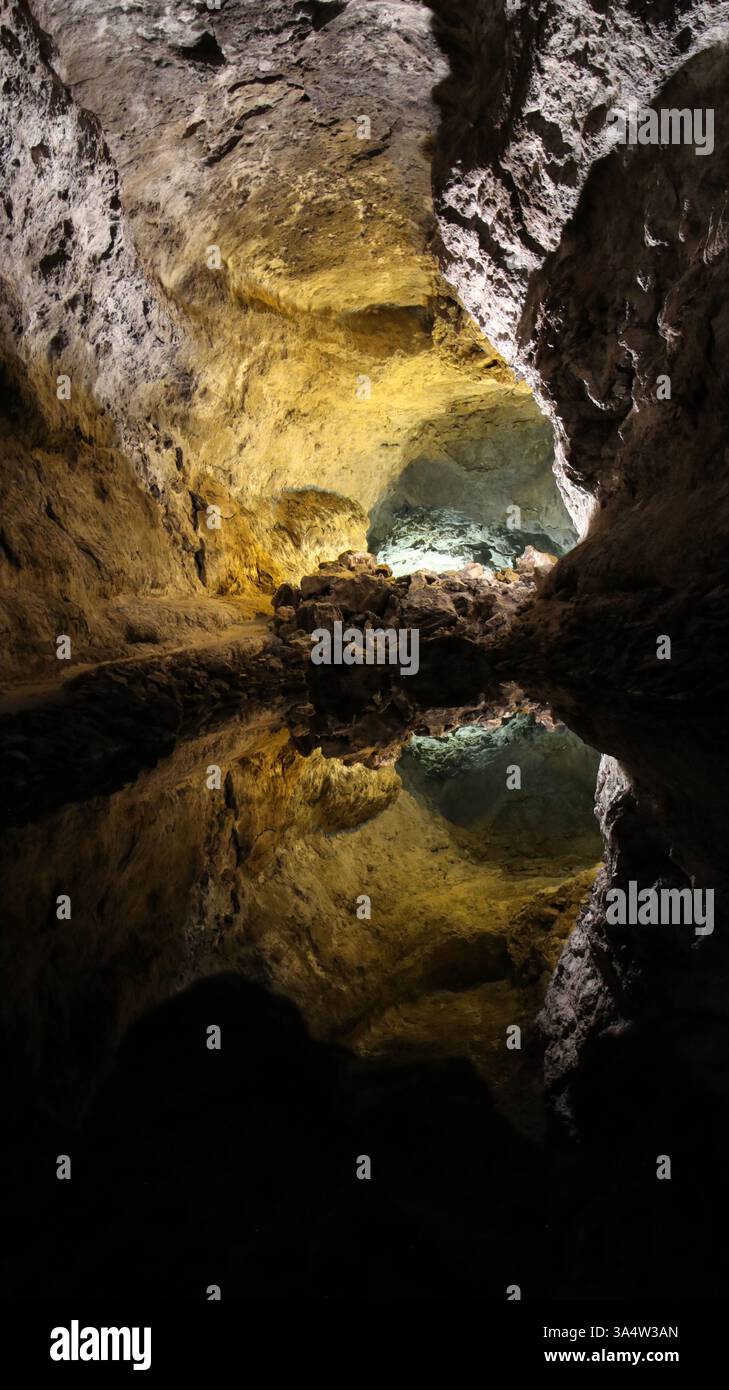 Underground Cave with Reflective Water and Dramatic Lighting Stock ...