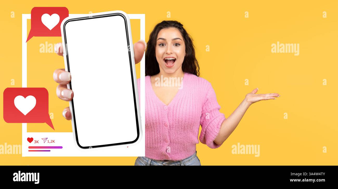 Engaging influencer showcasing smartphone with social media interaction ...
